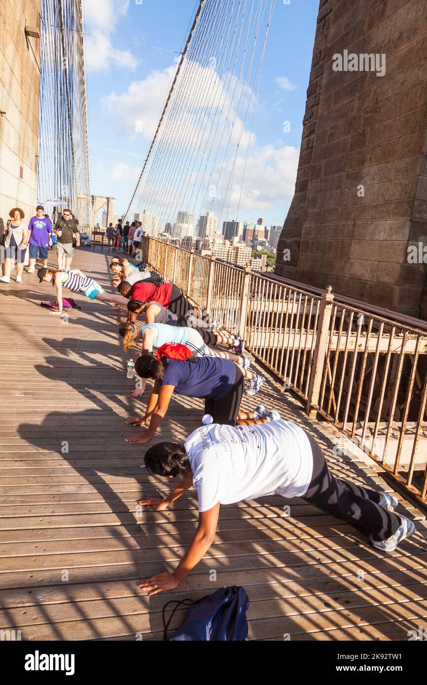 NEW YORK, USA - JULY 9, 2010: people exercise push-up at Brooklyn ...