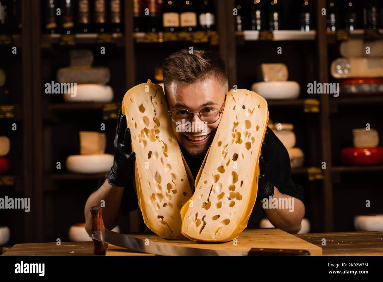 Funny crazy cheese sommelier with 2 pieces of limited maasdam natural ...
