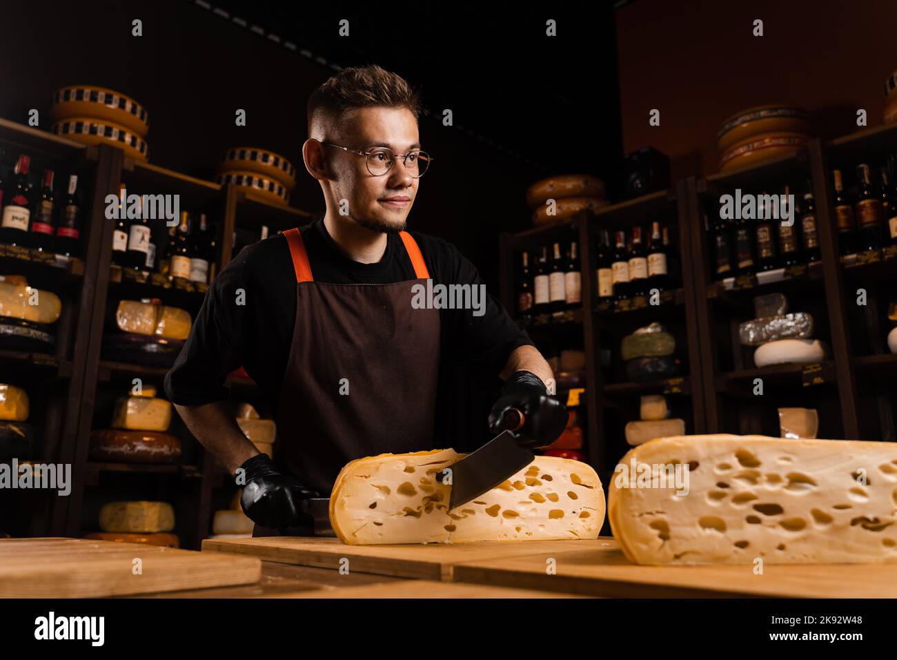 Cheese sommelier cutting limited maasdam natural aged with knife. Snack ...