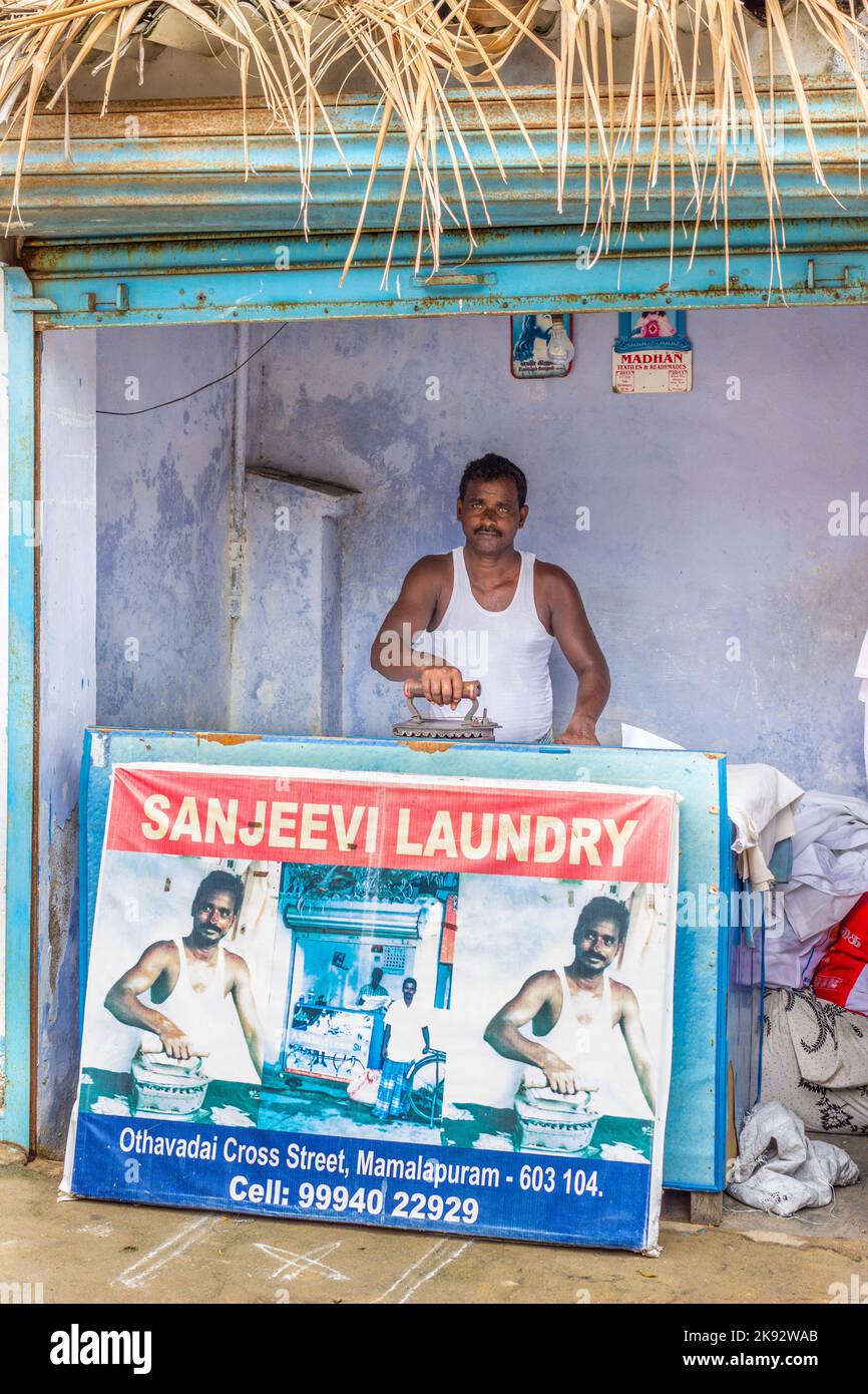 MALAPURAM, INDIA - AUG 26, 2012: laundry man poses at his shop with ...