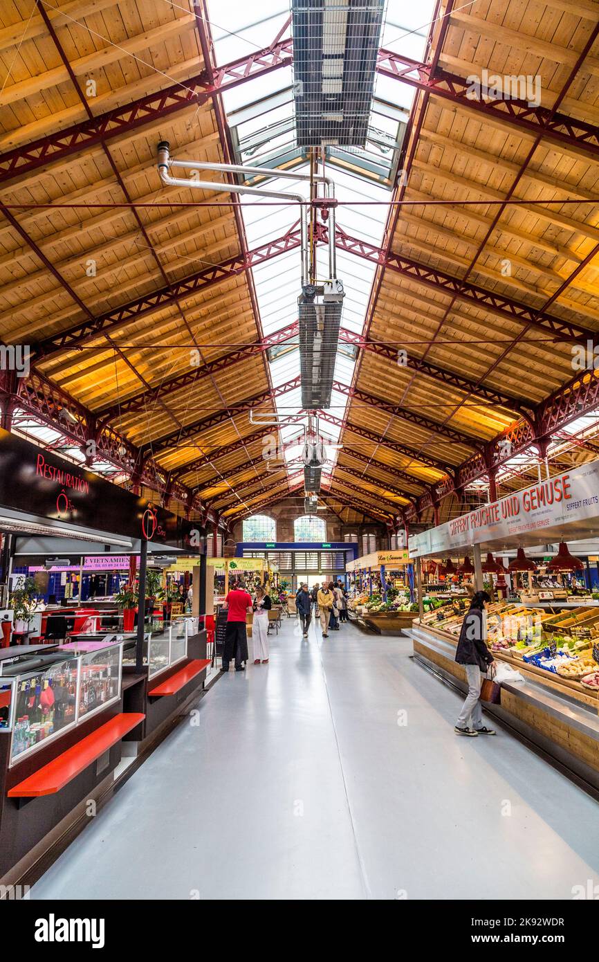 COLMAR, FRANCE - JULY 3, 2013: people shop in the old market hall in Colmar, France. Designed in ...