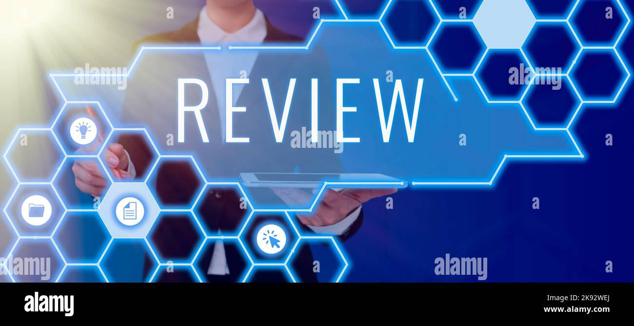 Hand writing sign Review. Concept meaning evaluates the work in ...