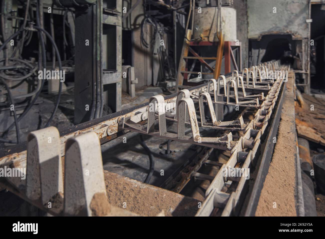 Stopped empty conveyor belt leading to the sand mold kiln Stock Photo ...