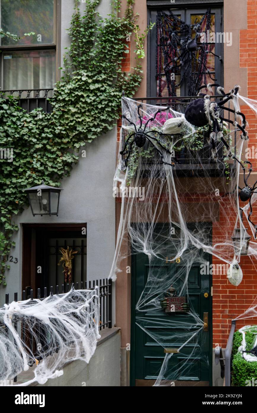 Front of apartment building decorated with spider web for Halloween ...