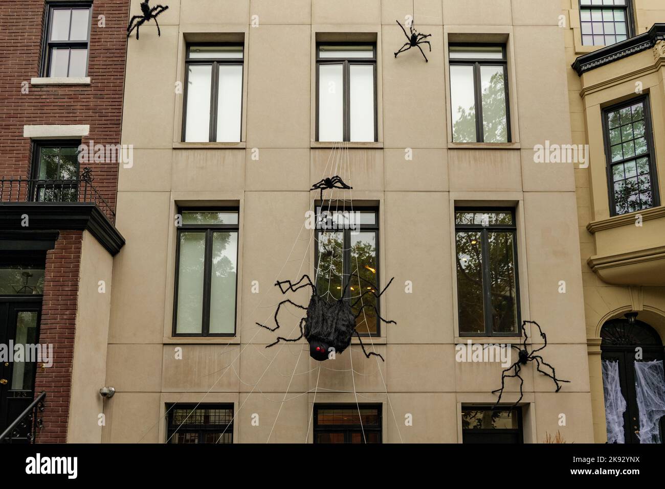 Front of apartment building decorated with spider web for Halloween ...