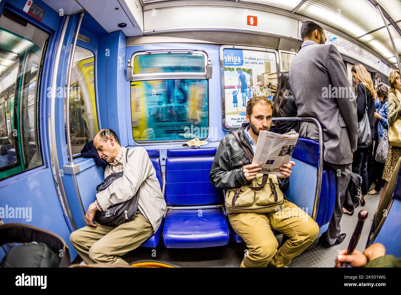 PARIS , FRANCE- JUNE 10, 2015: Tourists and locals on a subway train ...