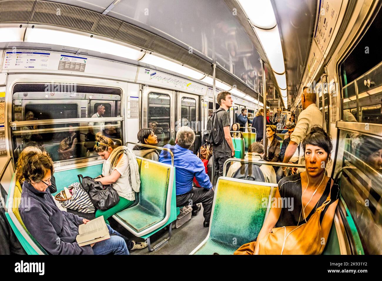 PARIS , FRANCE- JUNE 10, 2015: Tourists and locals on a subway train in ...