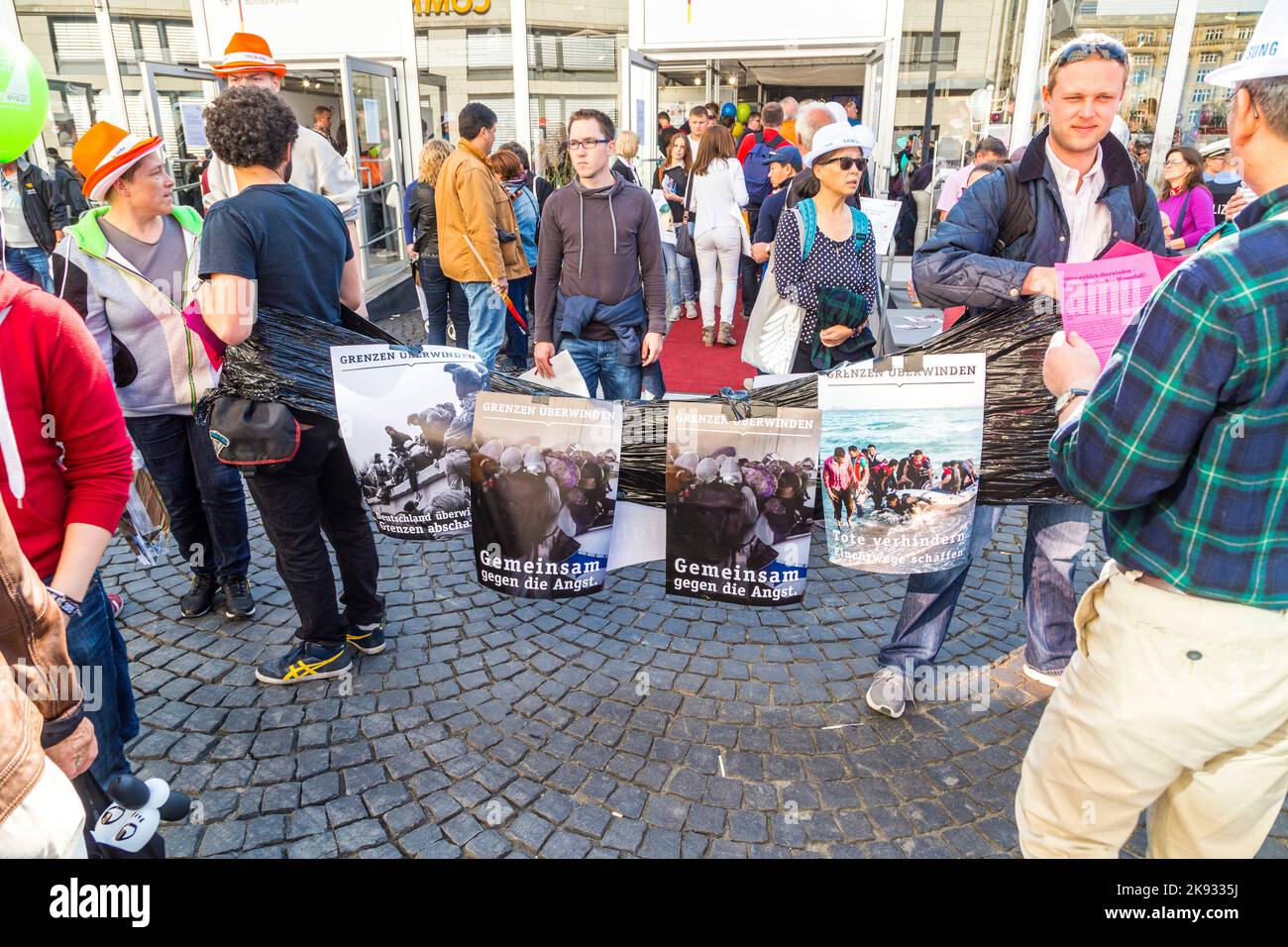 FRANKFURT, GERMANY - OCT 3, 2015: people protest for the welcome ...