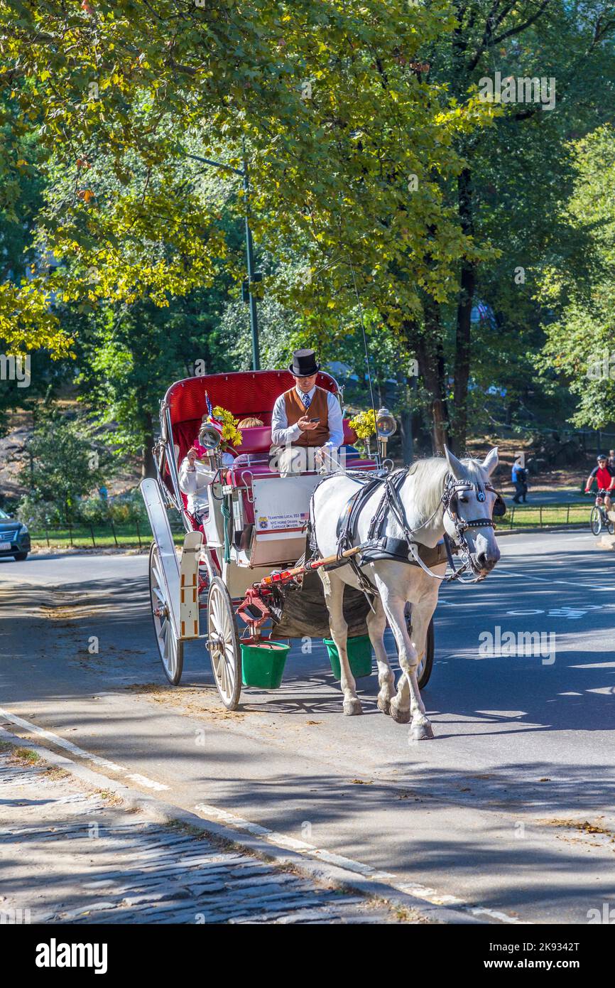 NEW YORK, USA - OCT 21, 2015: People enjoy carriage ride in Central ...