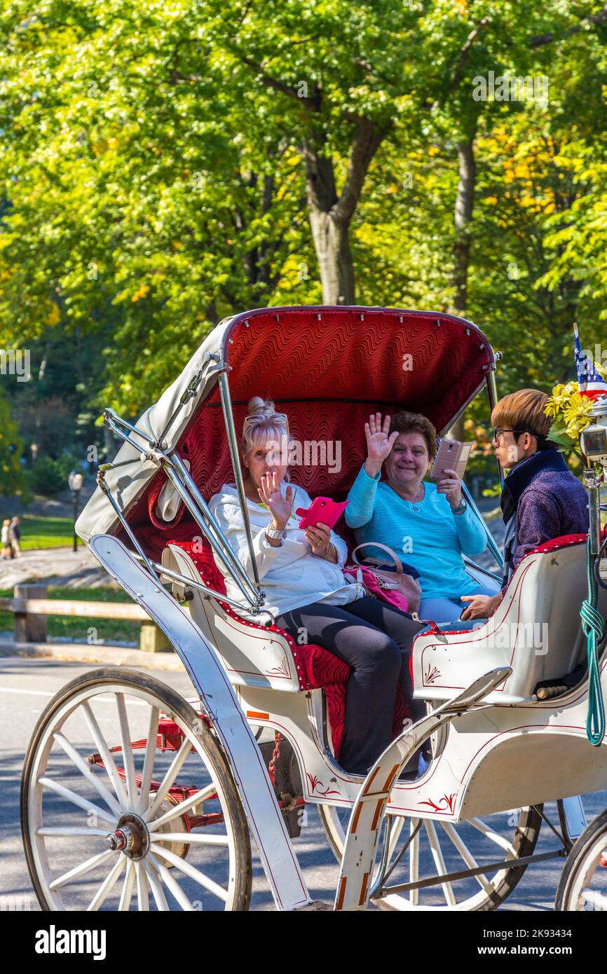 NEW YORK, USA - OCT 21, 2015: People enjoy carriage ride in Central ...