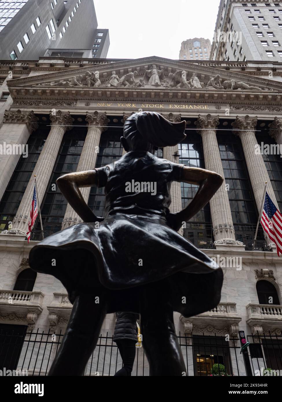 The Fearless Girl bronze statue in front of the New York Stock Exchange ...