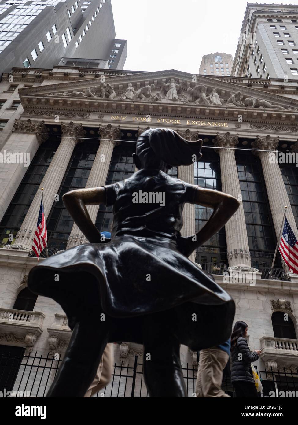 The Fearless Girl bronze statue in front of the New York Stock Exchange ...