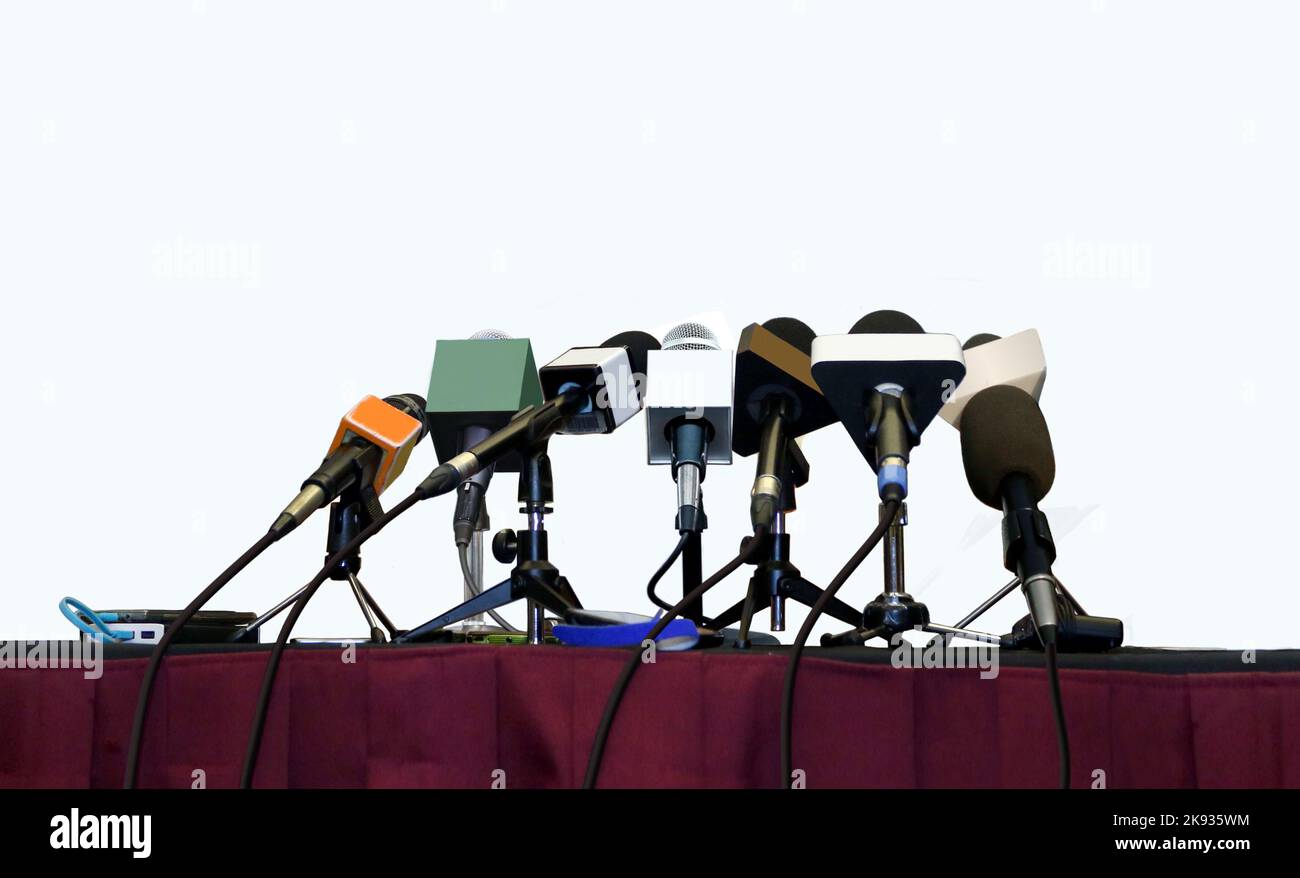 press conference microphones over white background Stock Photo - Alamy