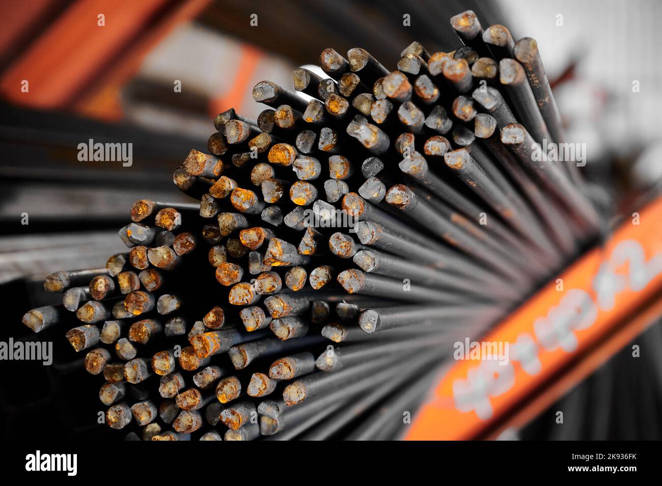 Thin metal rods bunch in cold plant warehouse macro view Stock Photo ...