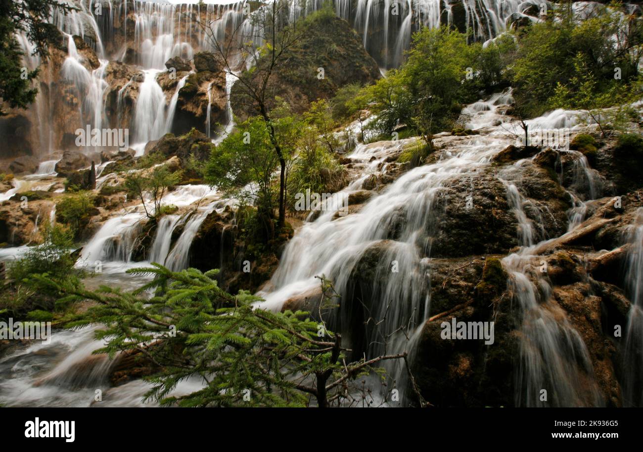 The Pearl Shoal waterfall cascades in the Rize Valley in Jiuzhaigou ...
