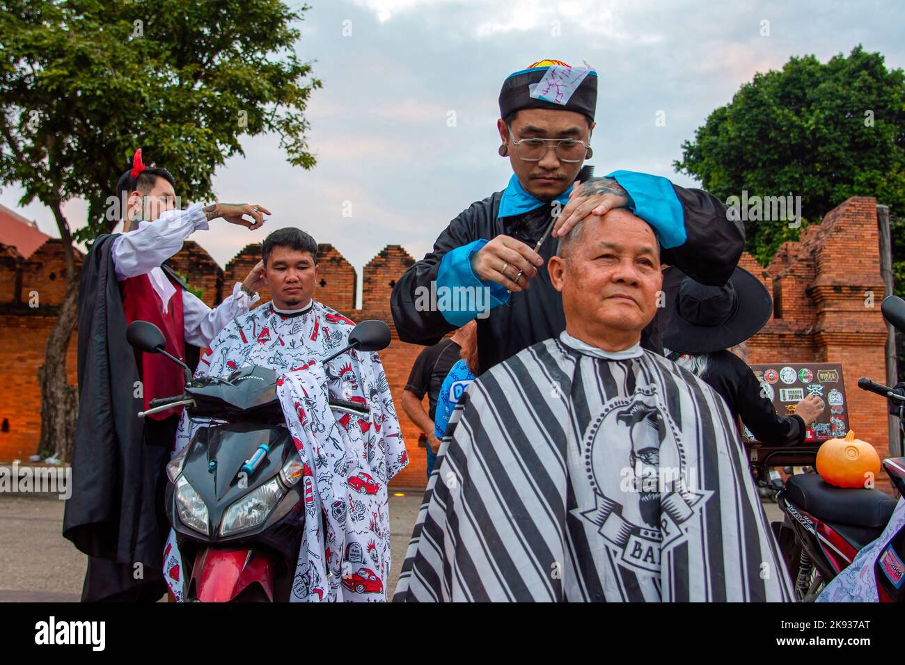 Barbers dressed in Chinese zombie, and Count Dracula costumes during ...
