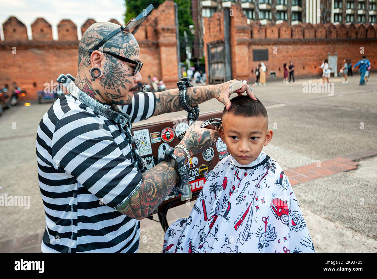 A barber dressed in prisoner ghost costume during the free haircut to ...