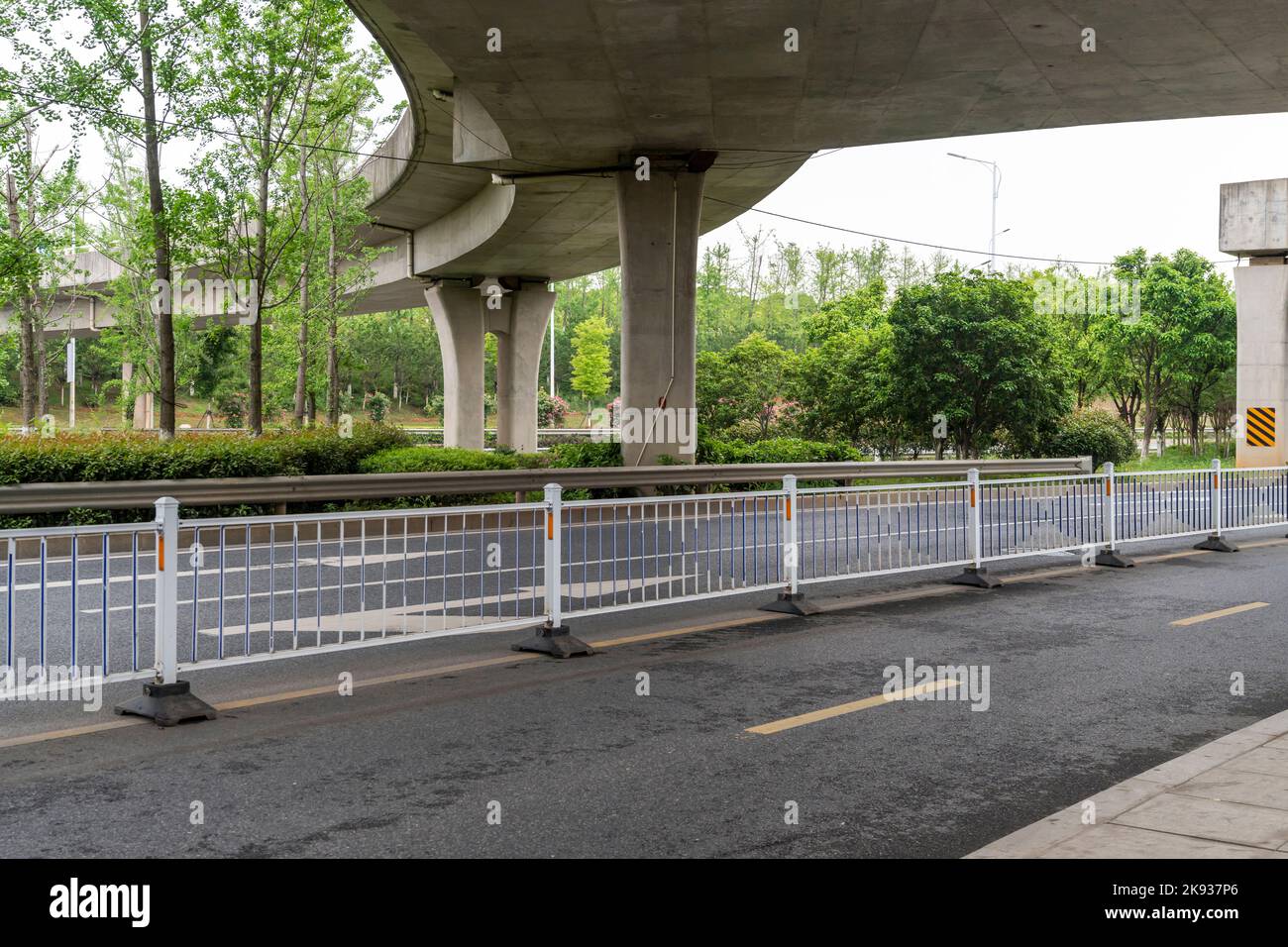 Concrete structure and asphalt road space under the overpass in the ...