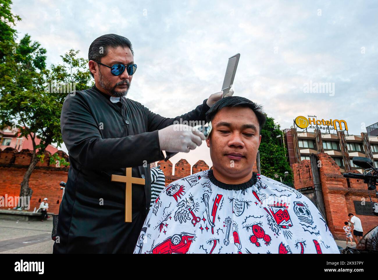 Chiang Mai, Thailand. 8th Mar, 2022. A barber dressed in pastor manders ...