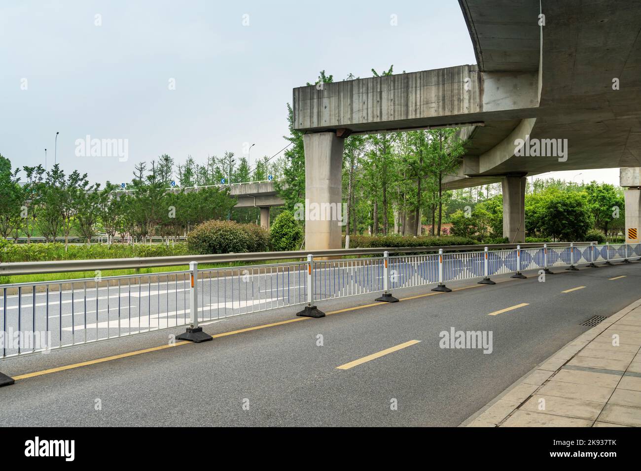 Concrete structure and asphalt road space under the overpass in the ...