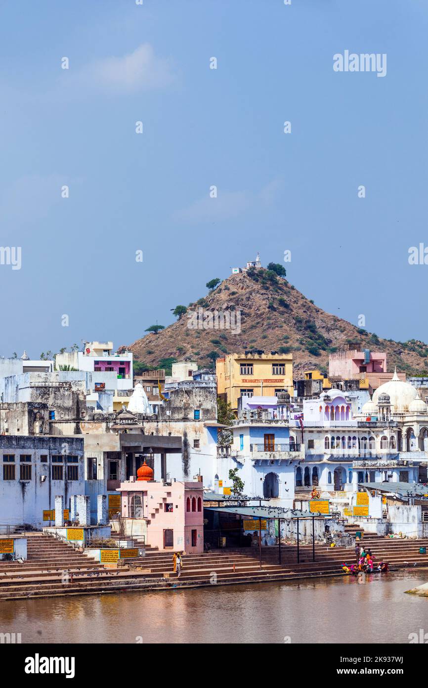 PUSHKAR, INDIA - OCTOBER 20, 2012: Pilgrims take ritual bathing in holy ...