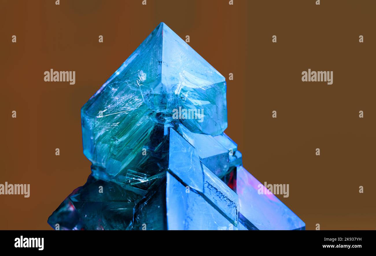blue crystalline mineral on brown background Stock Photo - Alamy