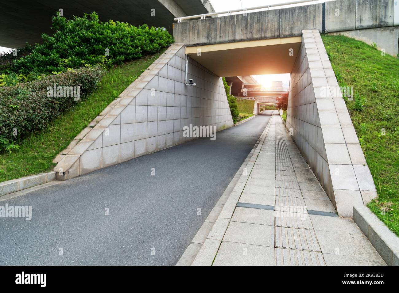 Concrete structure and asphalt road space under the overpass in the ...