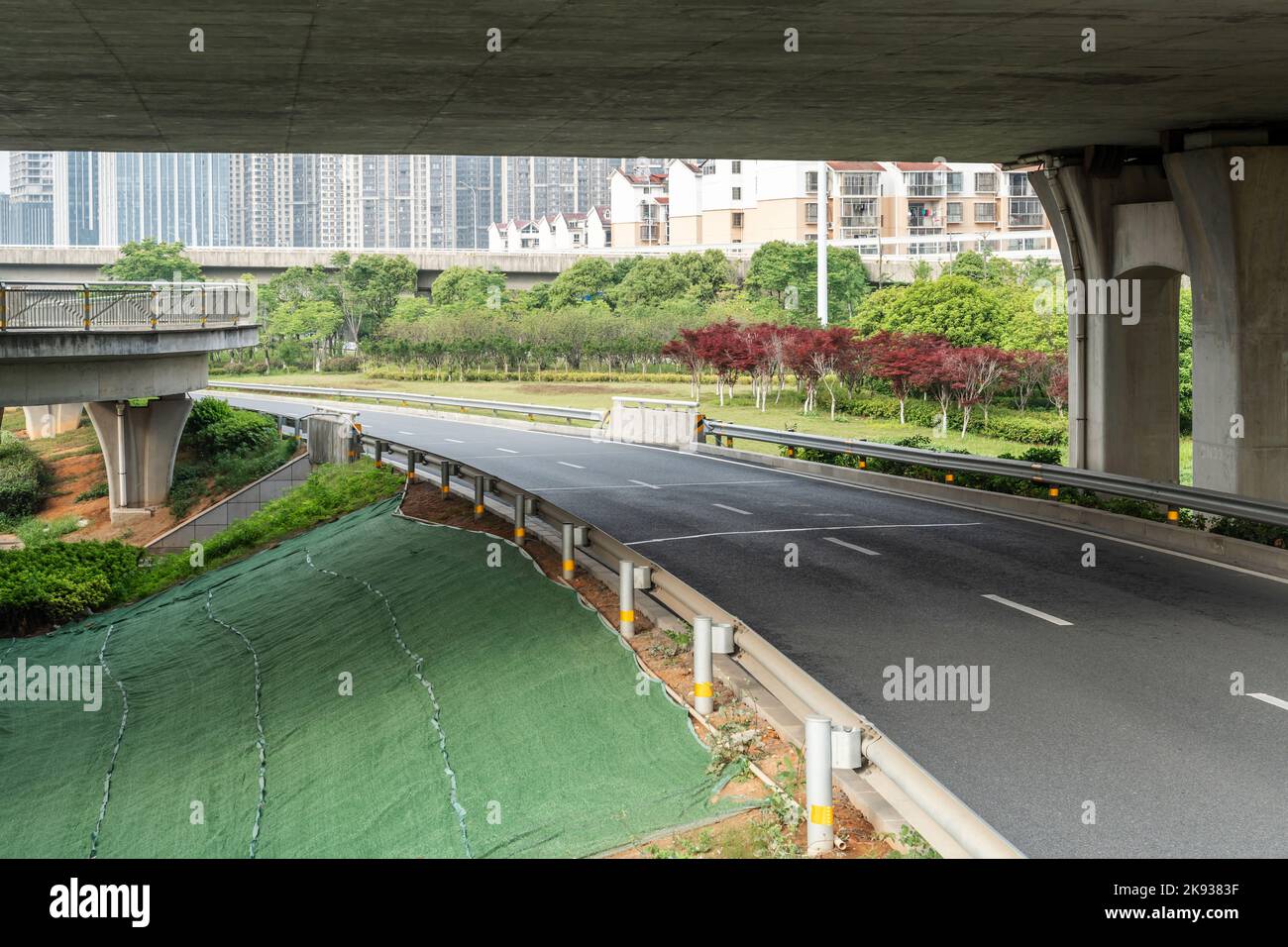 Concrete structure and asphalt road space under the overpass in the ...