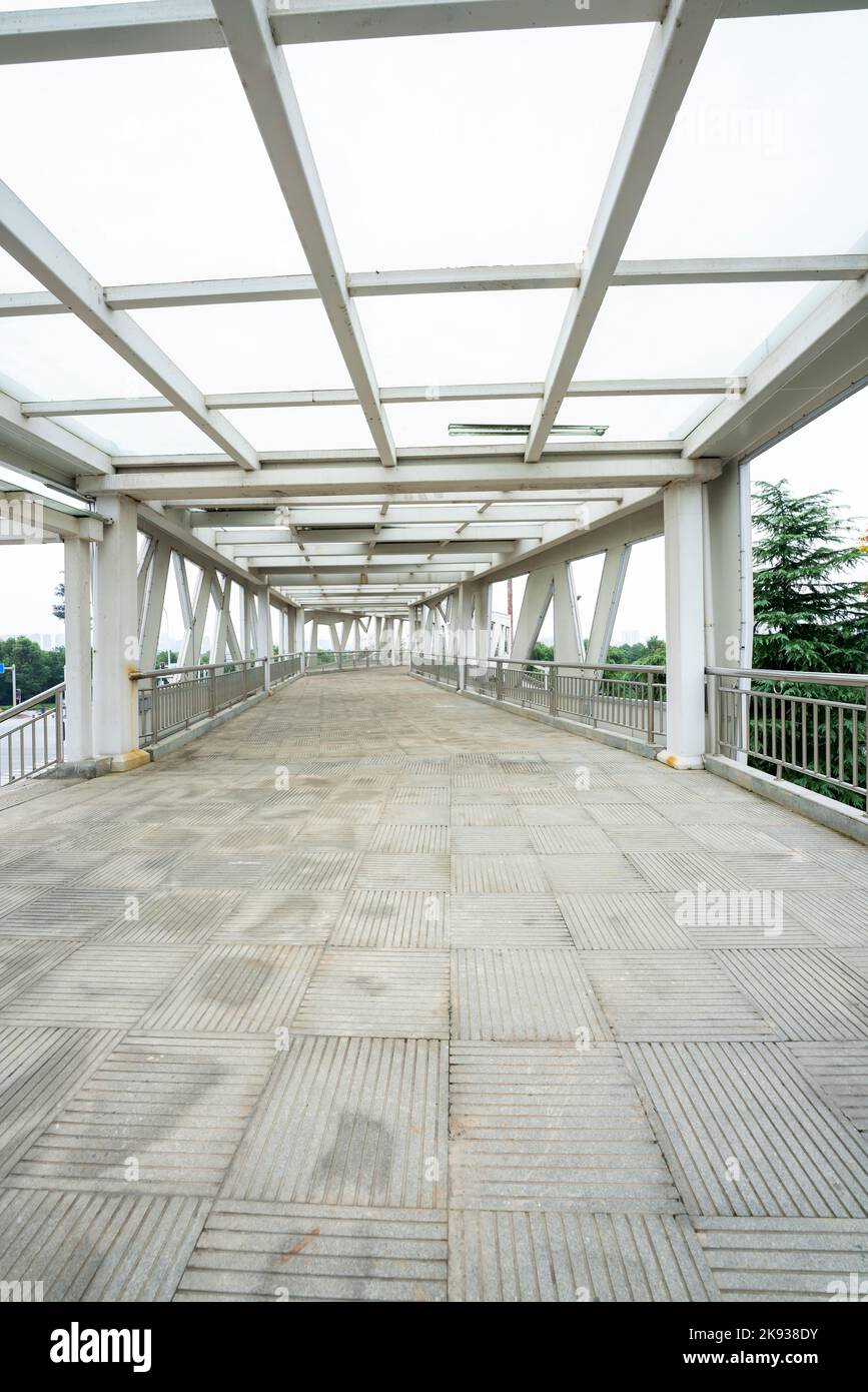 Inside of a modern overhead pedestrian bridge Stock Photo - Alamy