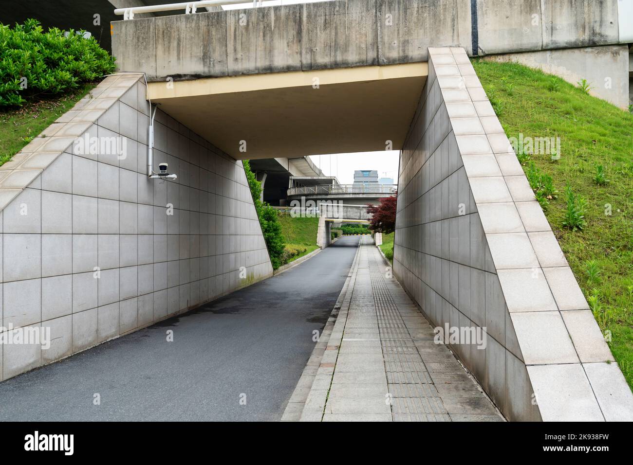 Concrete structure and asphalt road space under the overpass in the ...