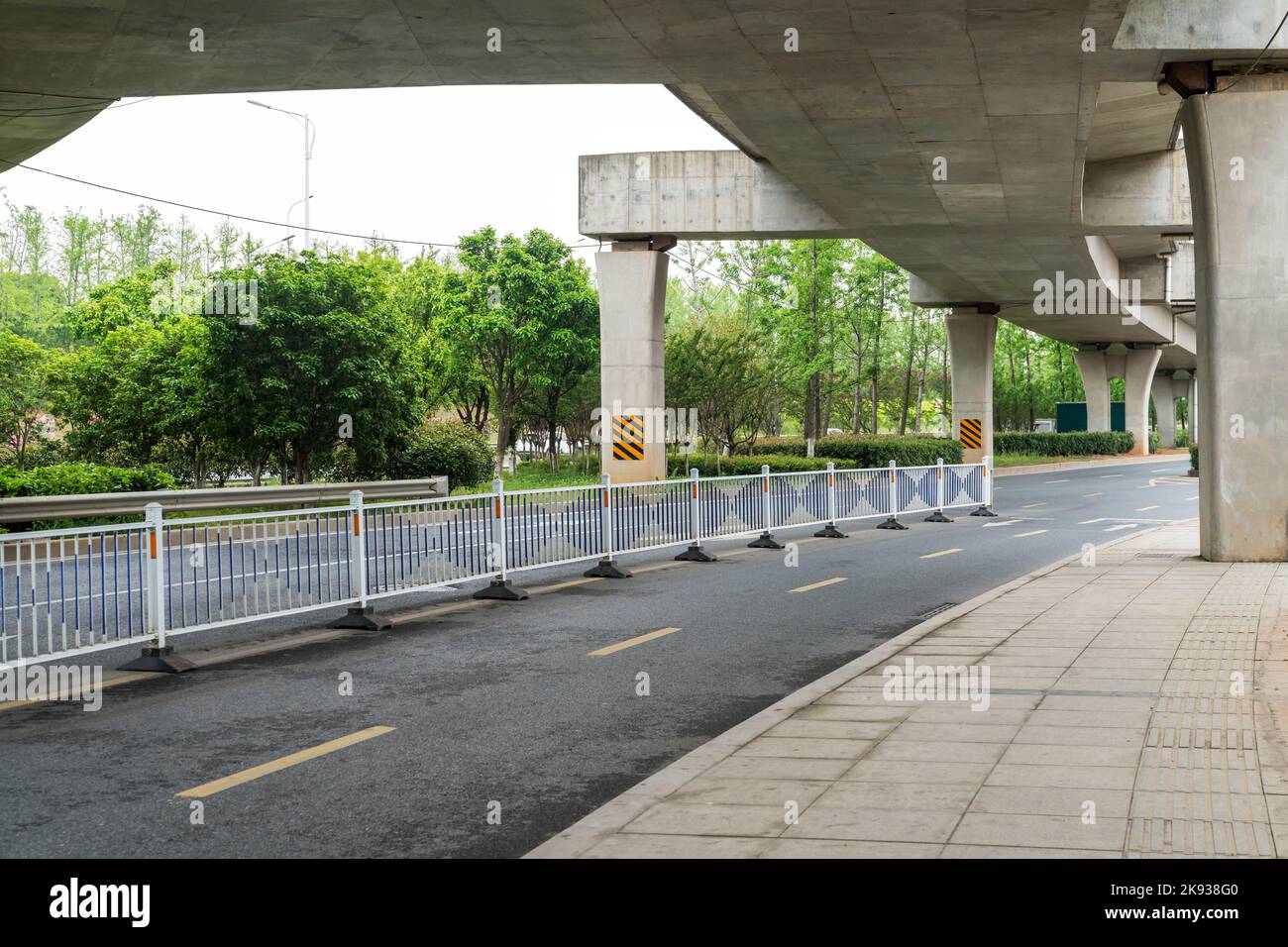 Concrete structure and asphalt road space under the overpass in the ...