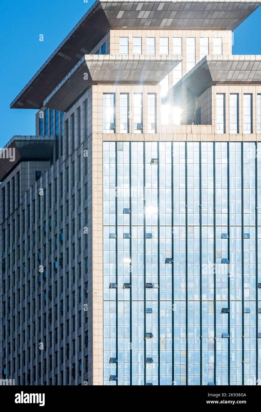 A beautiful background of an glass office building, reflecting clouds ...