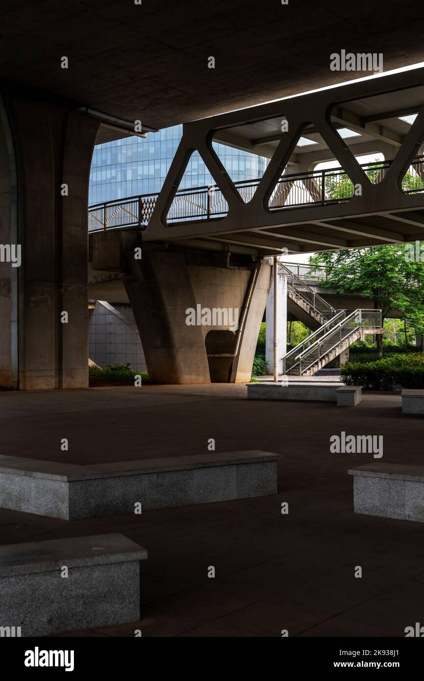Concrete structure and asphalt road space under the overpass in the ...