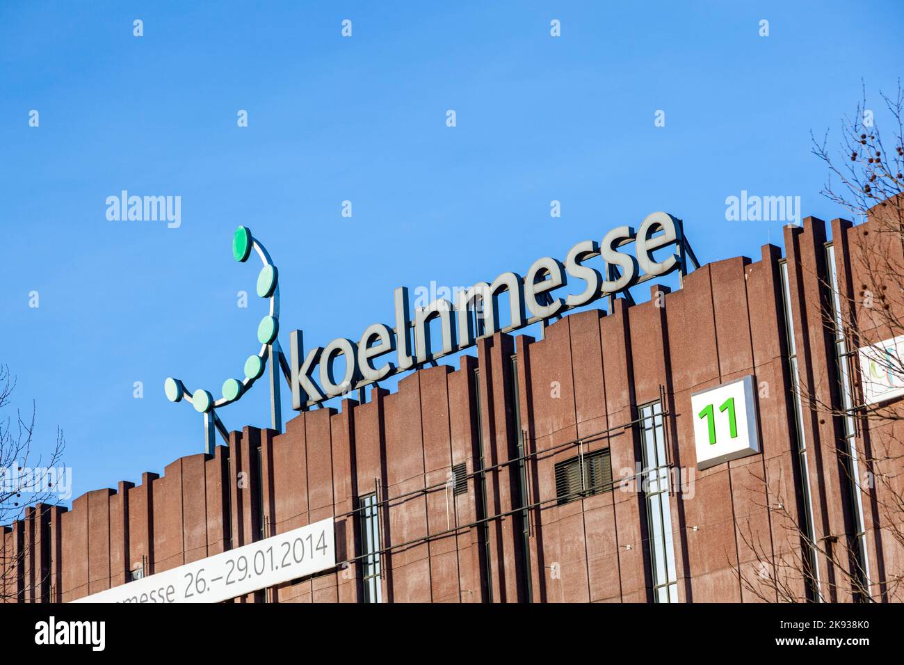 COLOGNE, GERMANY - JAN 29: facade of trade fair building and banner of ...