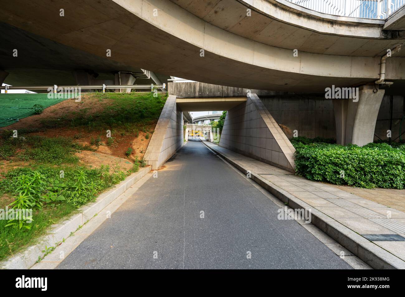 Concrete structure and asphalt road space under the overpass in the ...