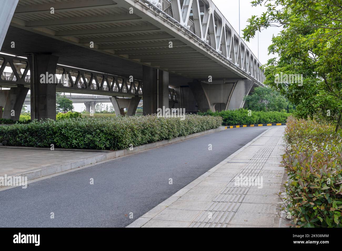 Concrete structure and asphalt road space under the overpass in the ...