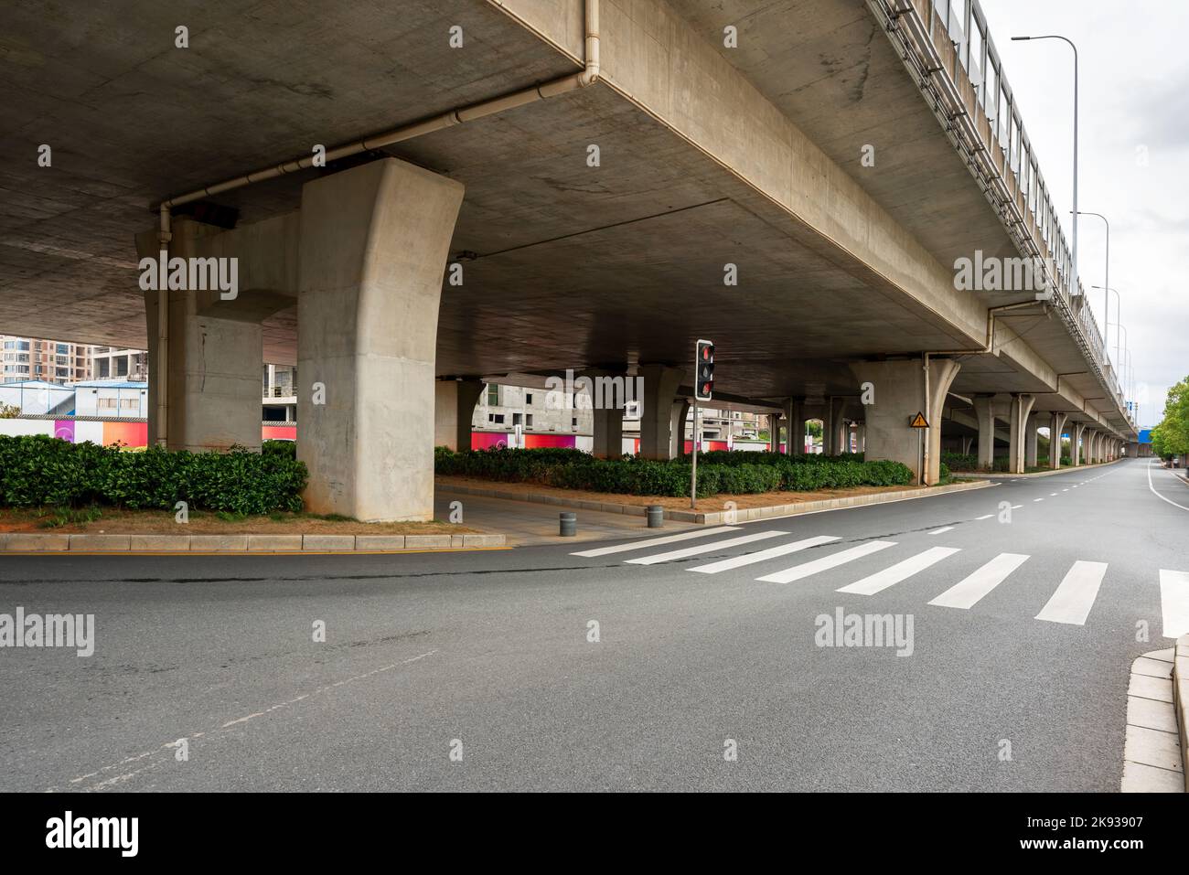 Concrete structure and asphalt road space under the overpass in the ...