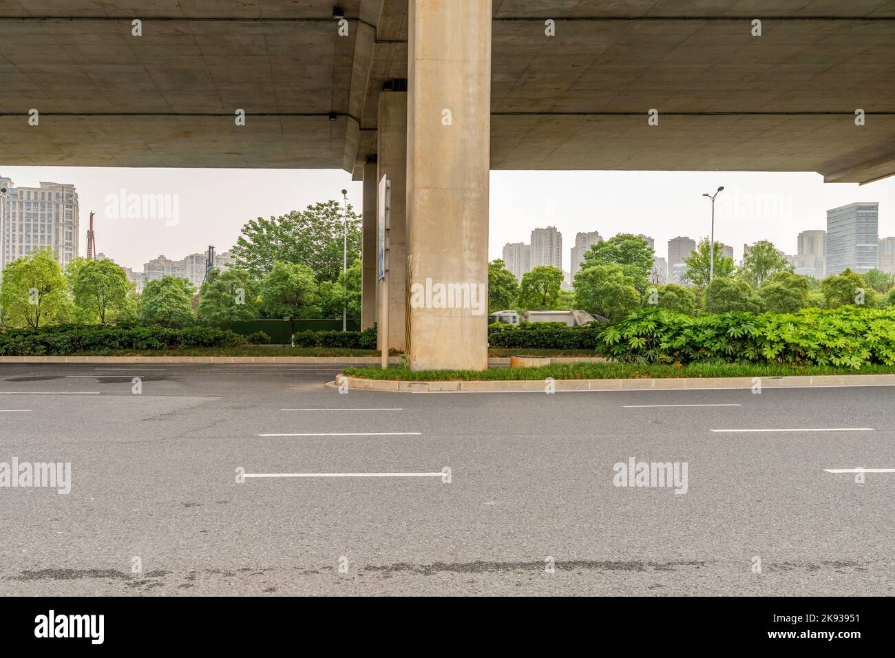 Concrete structure and asphalt road space under the overpass in the ...