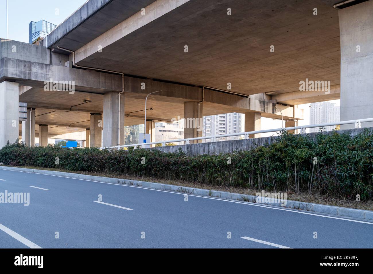 Concrete structure and asphalt road space under the overpass in the ...