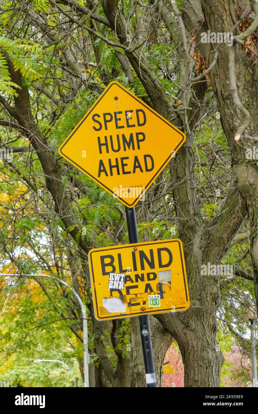 Speed hump ahead, blind and deaf signs. Wicker Park neighborhood ...