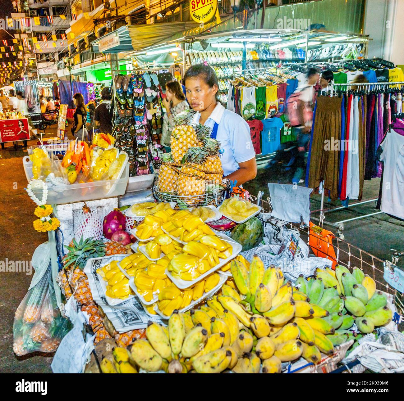 BANGKOK, THAILAND - DEC 23, 2009:woman sells fruits at her streetside ...