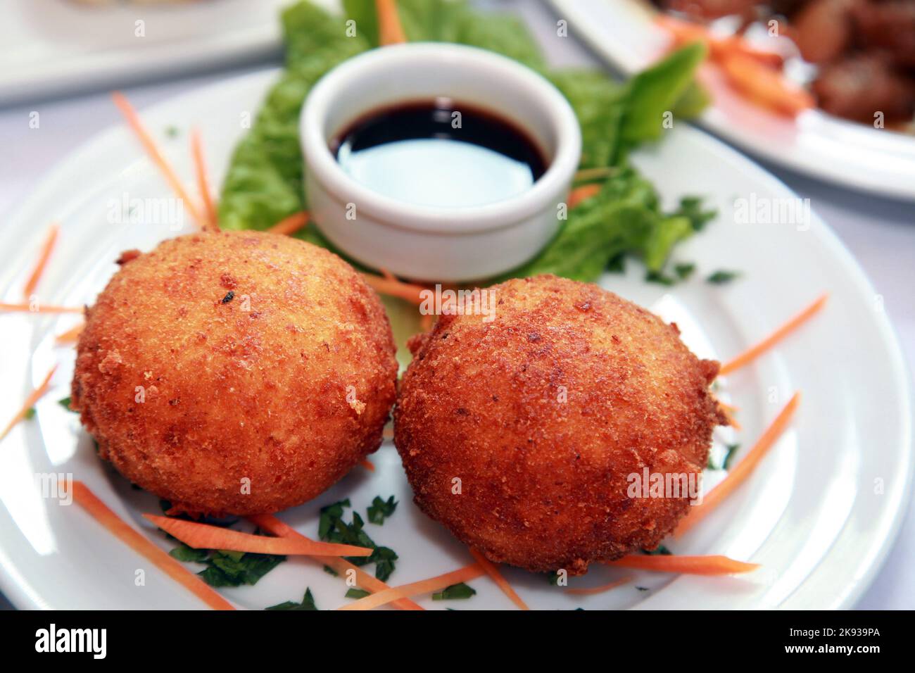 Potato balls with sauce on the dinner plate Stock Photo - Alamy