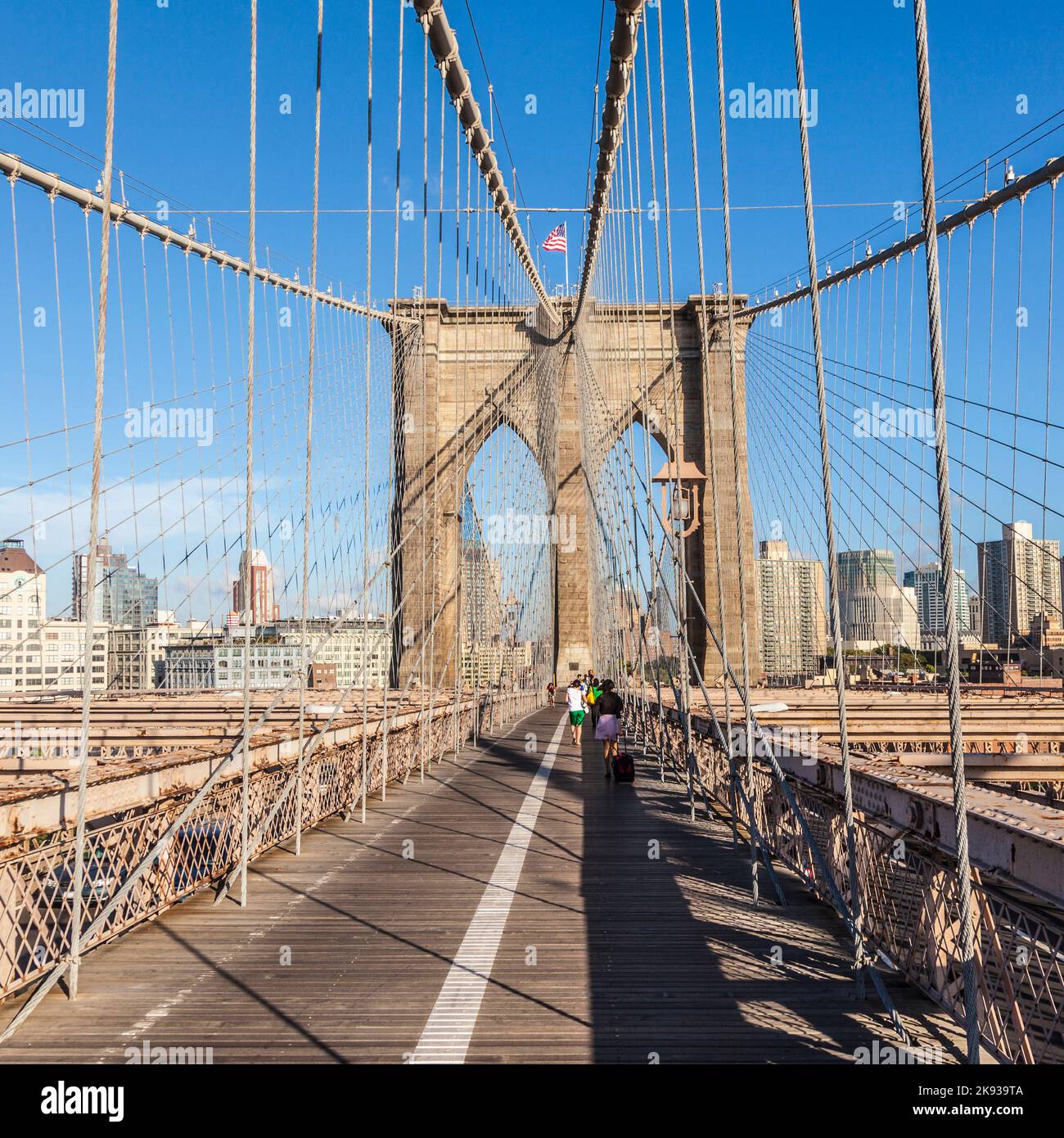 NEW YORK CITY - JULY 9, 2010: Tourists and residents cross Brooklyn ...