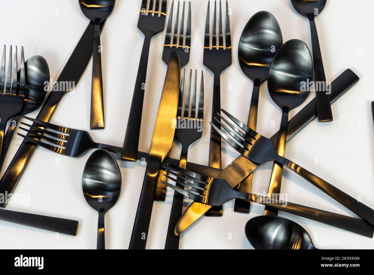 black metal forks and spoons on a white background, mexico Stock Photo ...