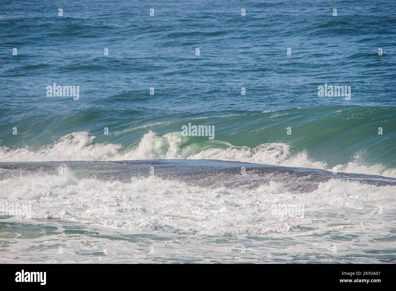 wave known as shorebreak at post six on Copacabana Beach in Rio de ...