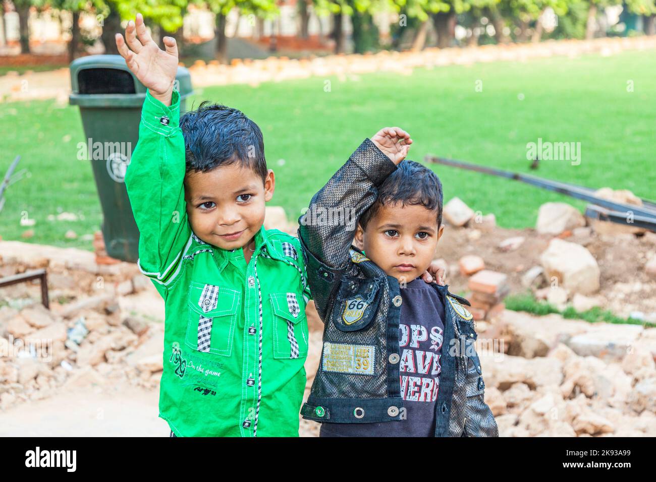 DELHI, INDIA - NOVEMBER 9, 2011: two children smile and pose for camera ...