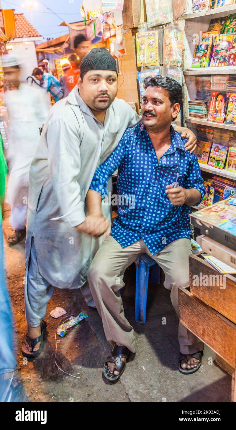 DELHI - NOVEMBER 10, 2011: small shop owner indian man selling ...