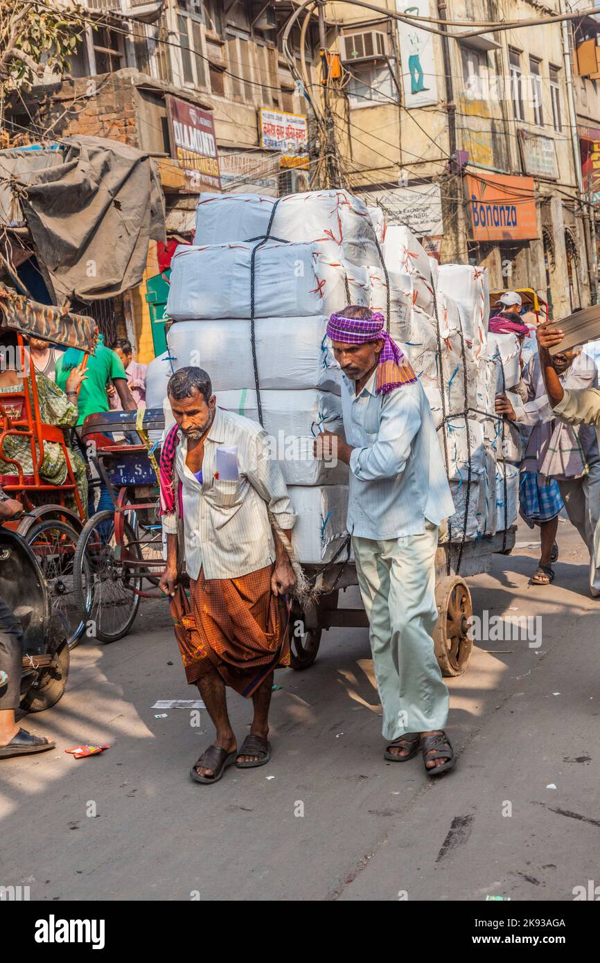 DELHI, INDIA - NOVEMBER 11, 2011: Cycle rickshaws with cargo load in ...