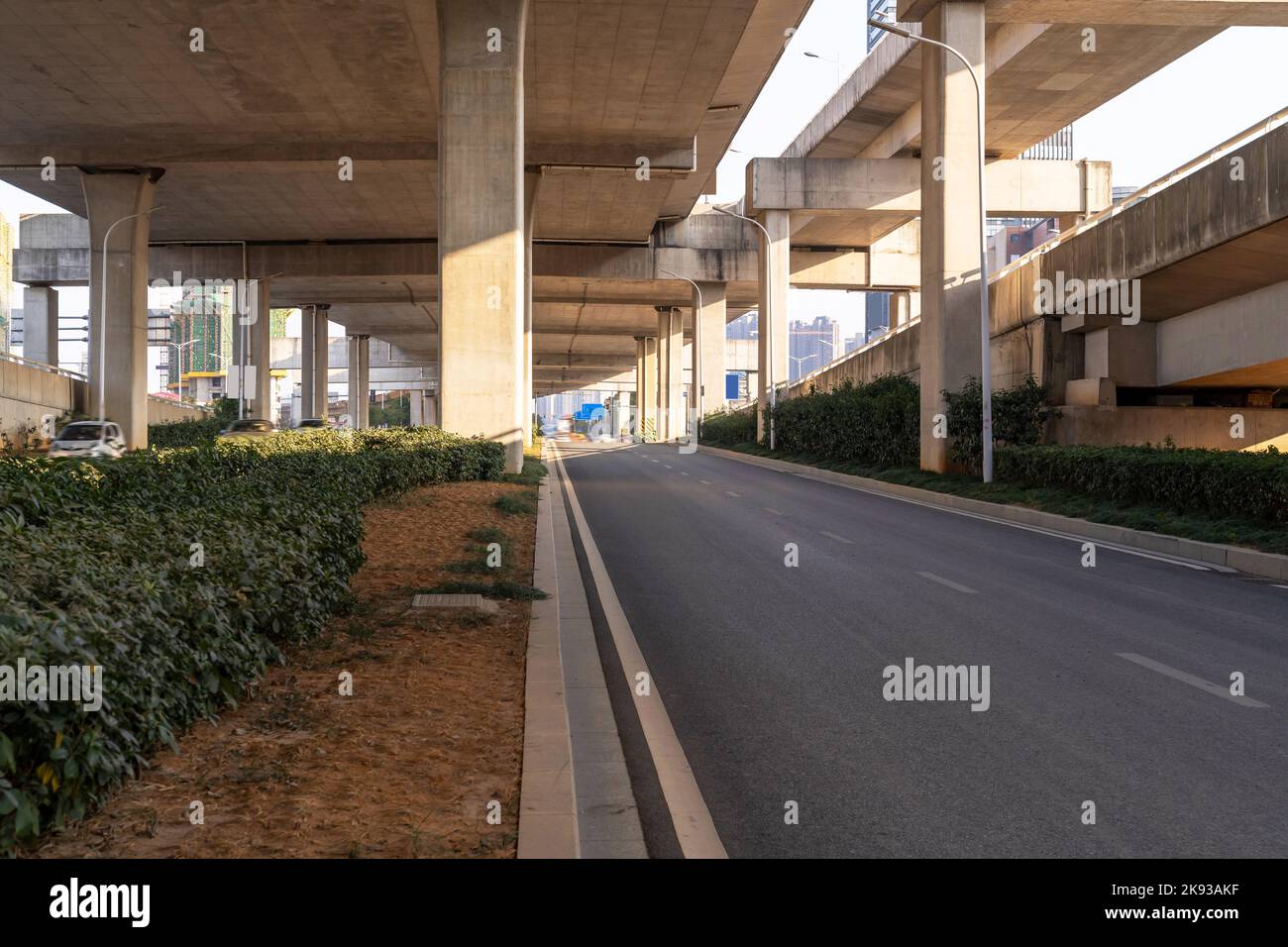 Concrete structure and asphalt road space under the overpass in the ...