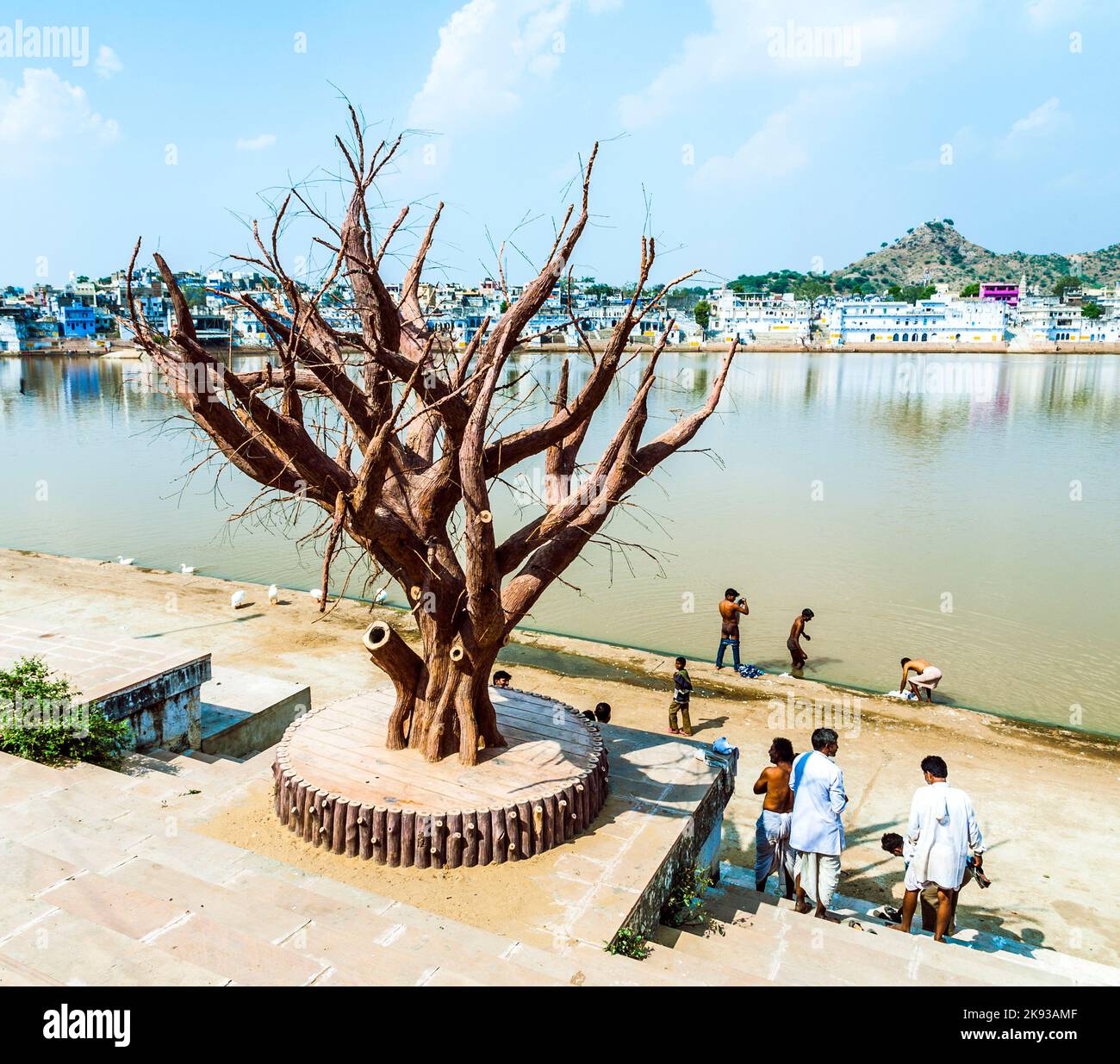PUSHKAR, INDIA - OCTOBER 20, 2012: Pilgrims take ritual bathing in holy ...